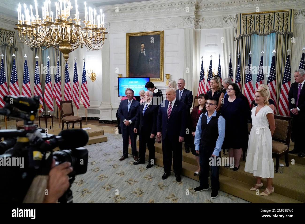 President Donald Trump and Vice President Mike Pence pose for a group ...