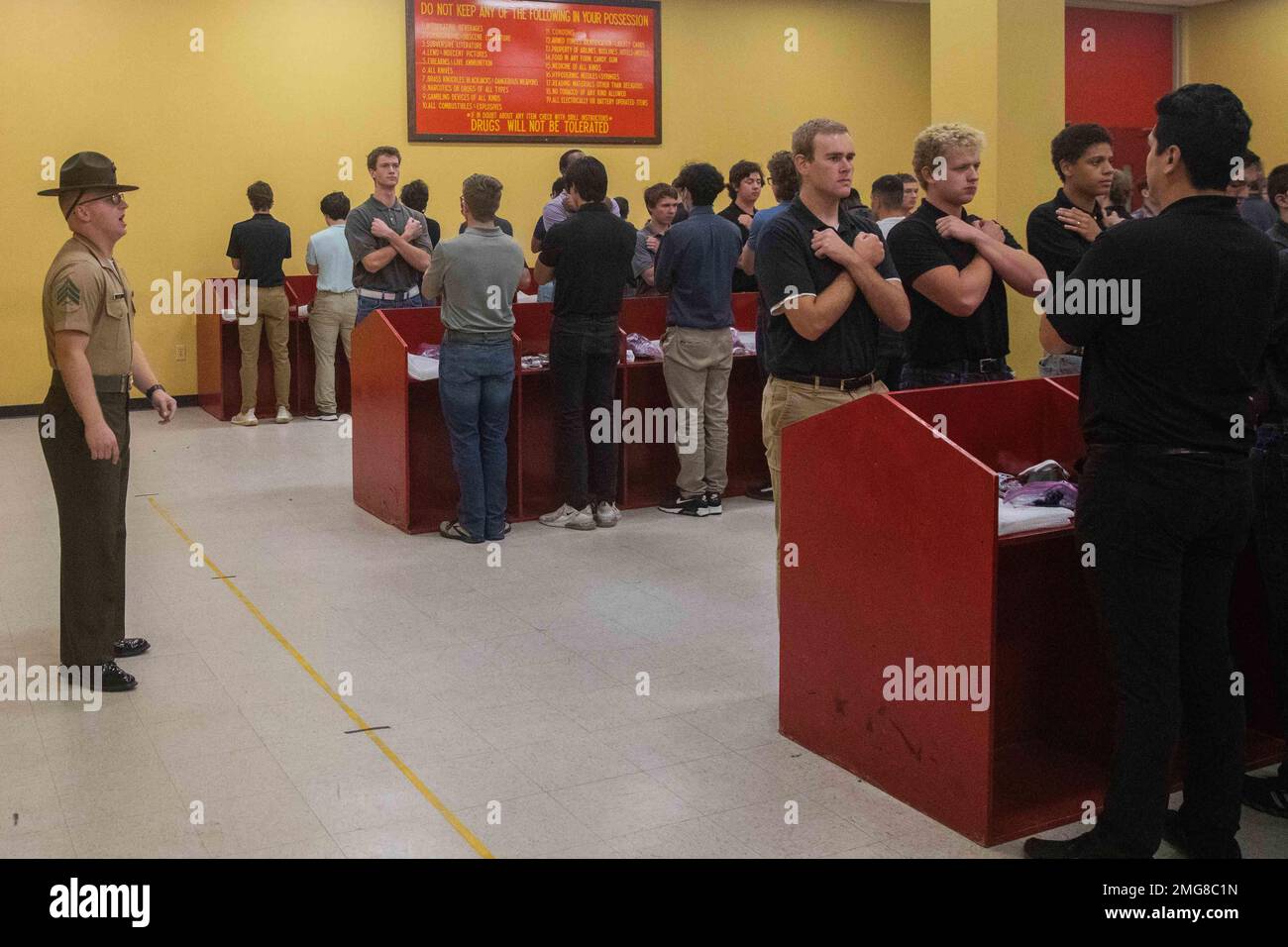 U.S. Marine Corps Sgt. Griffin Kozak, left, a drill instructor with ...
