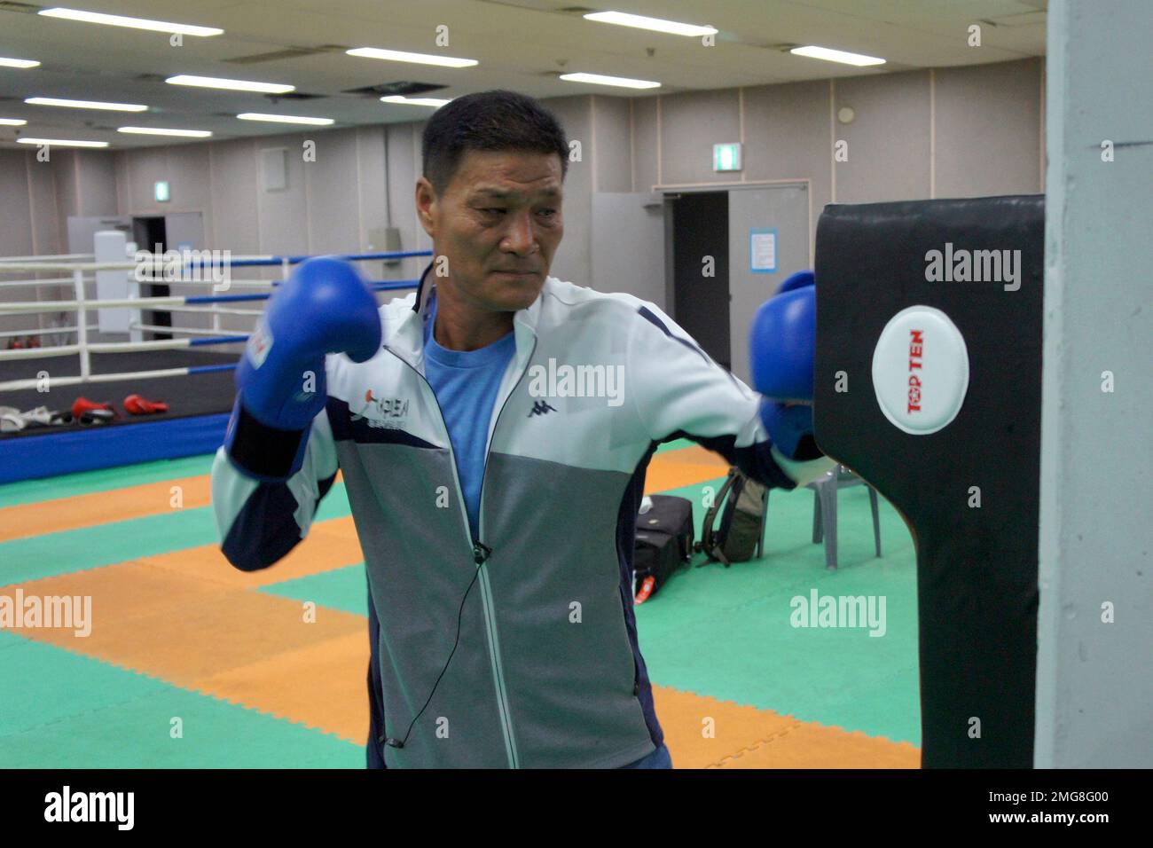 Former Olympic gold medalist Park Si-hun wearing boxing gloves punches ...