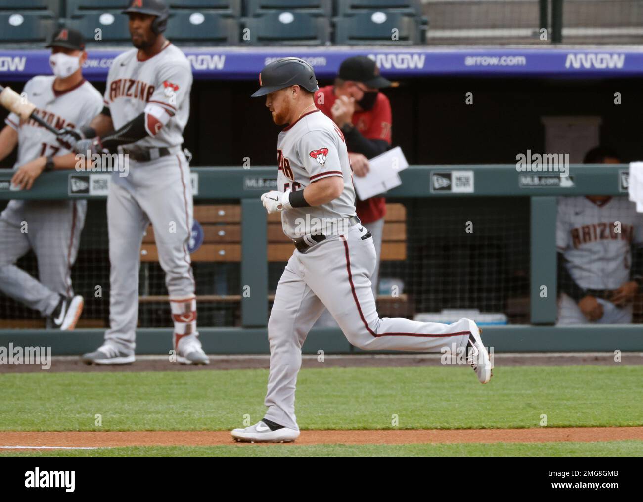 Arizona Diamondbacks' Kole Calhoun runs the bases after hitting a home ...
