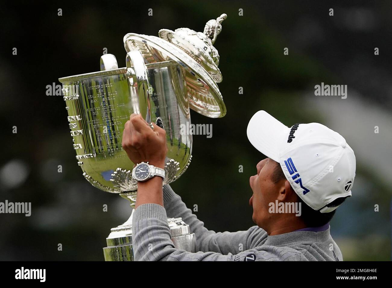 Collin Morikawa reacts as the top of the Wanamaker Trophy falls after ...