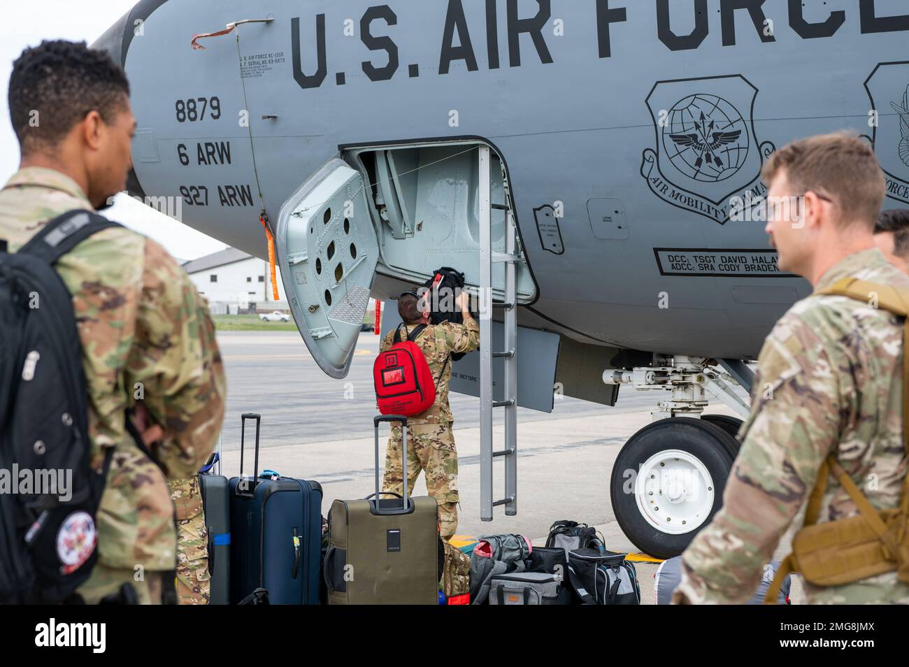 6th Air Refueling Wing Airmen offload baggage from a KC-135 ...