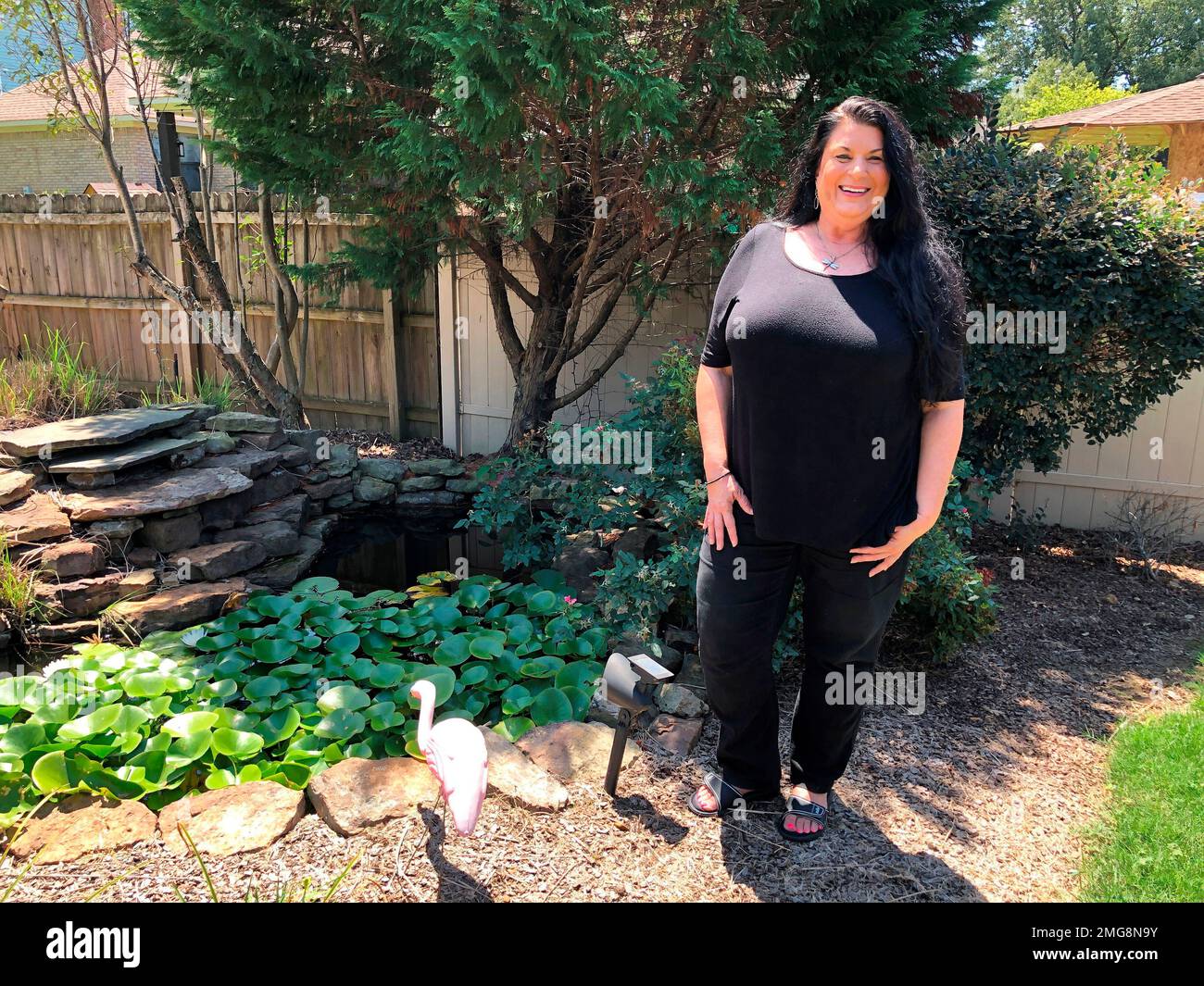 Lisa Vines poses for a photo in the backyard of her home on Friday ...