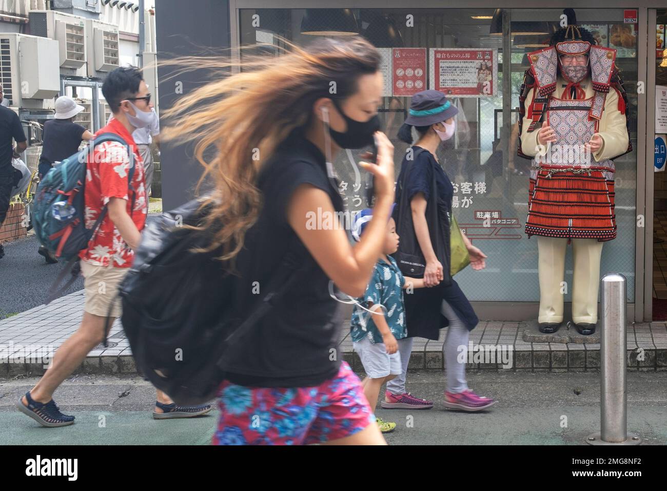 People wearing face masks to protect against the spread of the ...