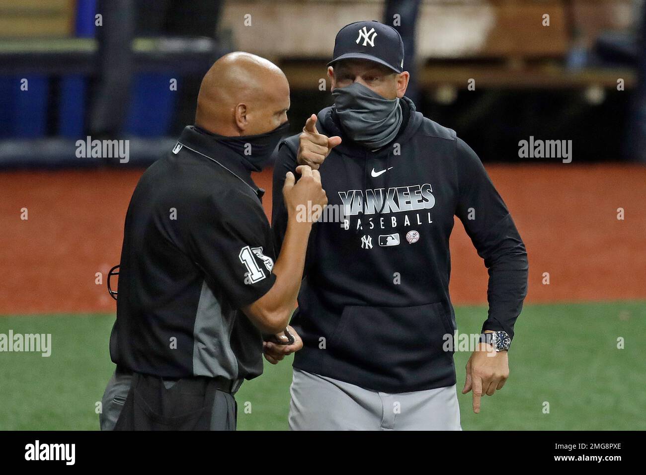 New York Yankees manager Aaron Boone, right, argues with home plate ...