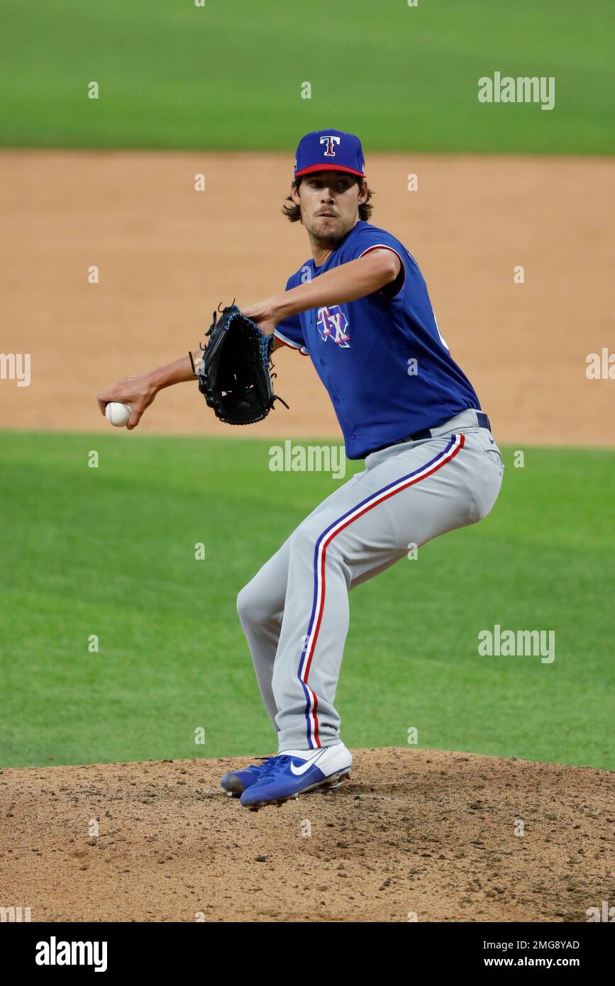 Texas Rangers pitcher Luke Farrell throws to the plate during a ...