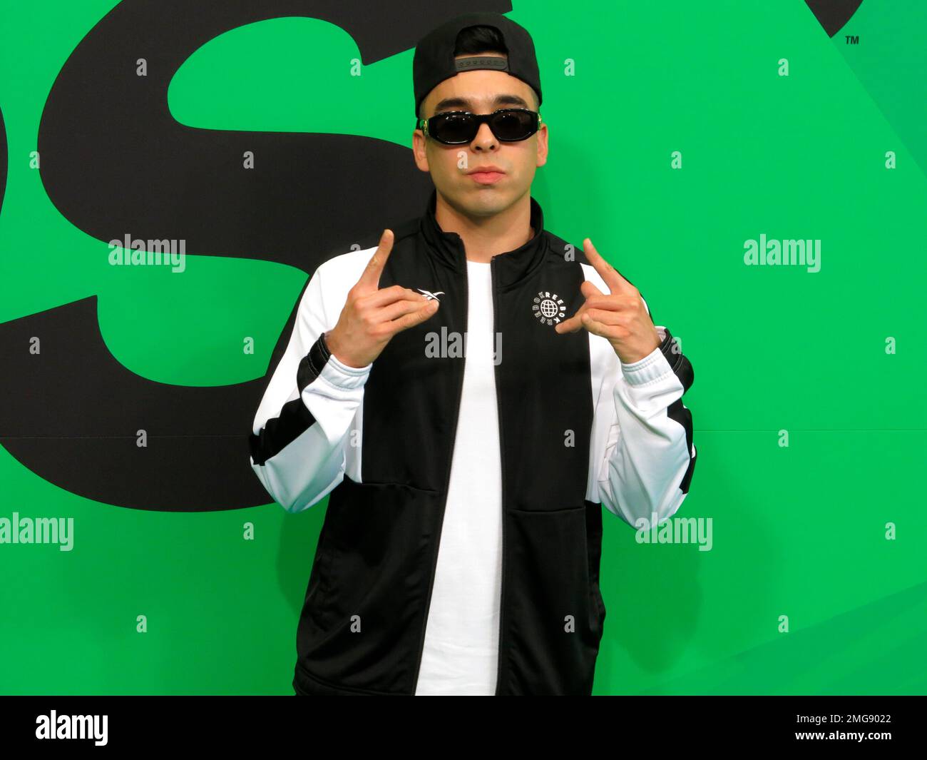 The Mexican raper MC Davo poses for photographers as he arrives at the ...