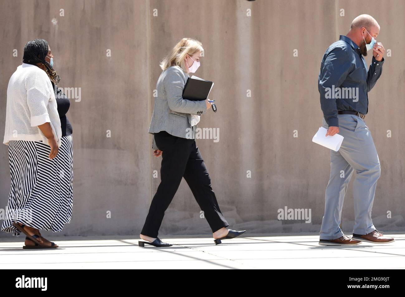 Aubrey "Bart" Willis, right, and Carolyn Johnson, left, exit the Thad ...