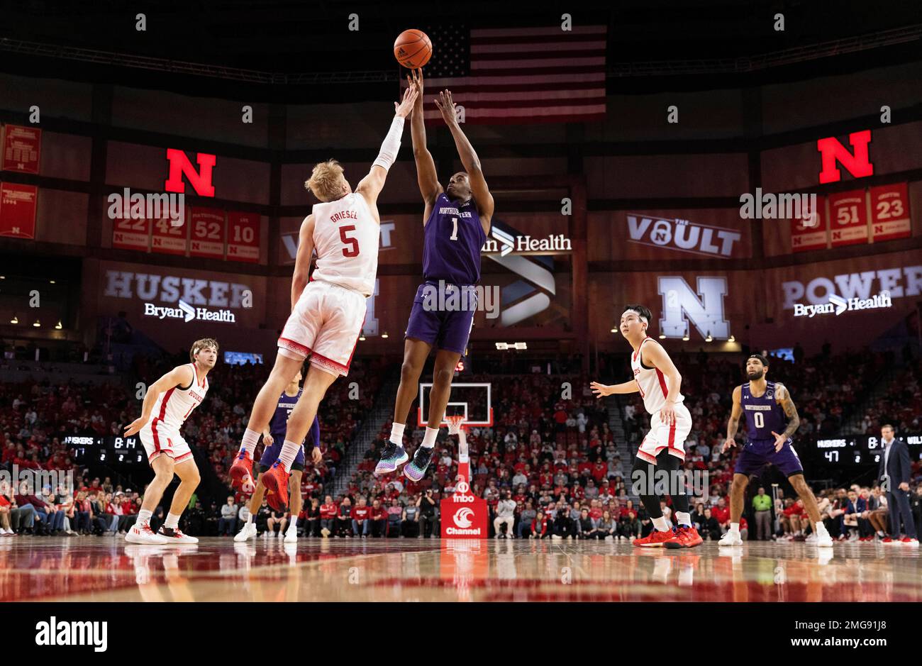 Northwestern's Chase Audige (1) shoots against Nebraska's Sam Griesel ...