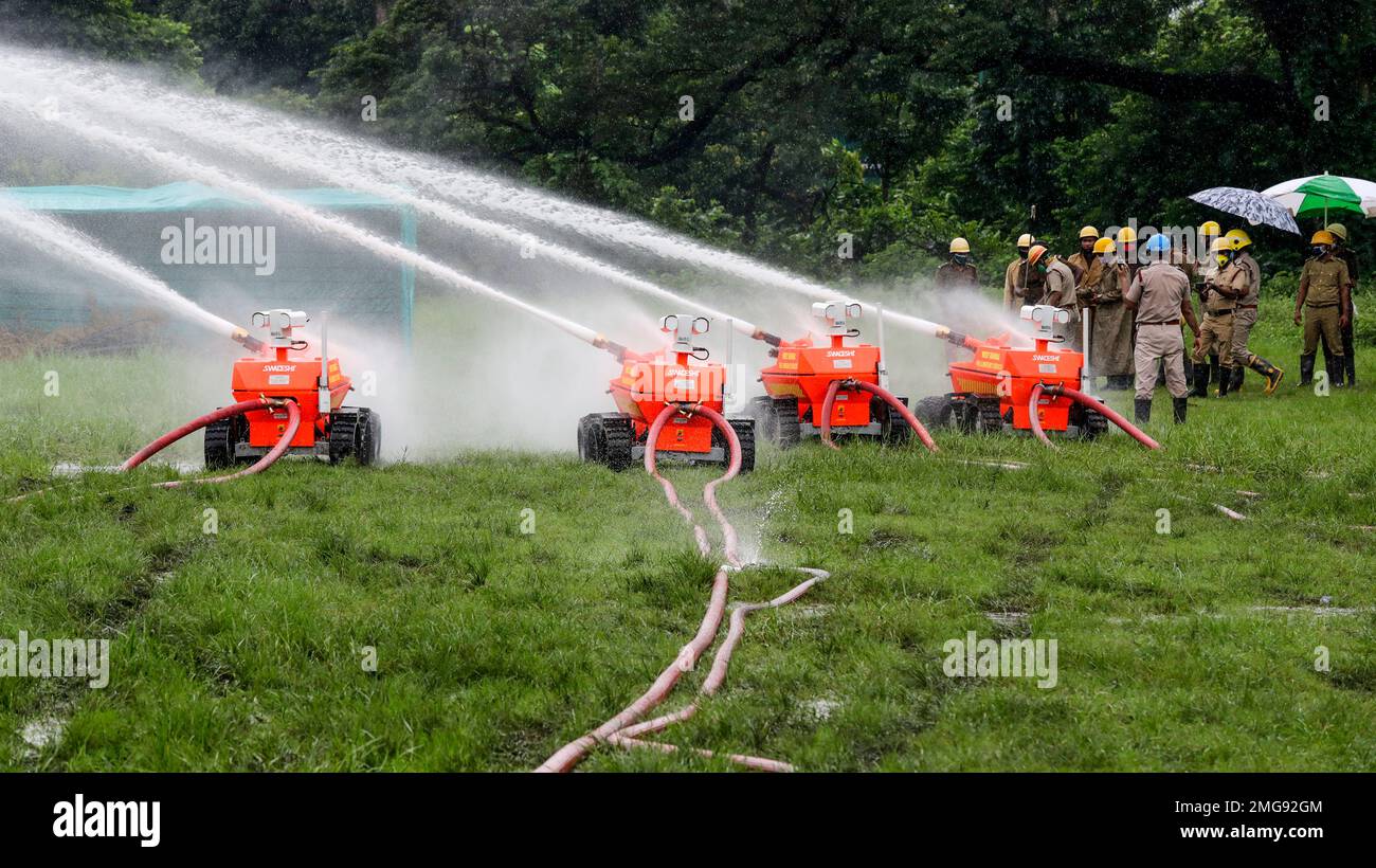 Indian fire fighters watch a demonstration of remotely controlled ...