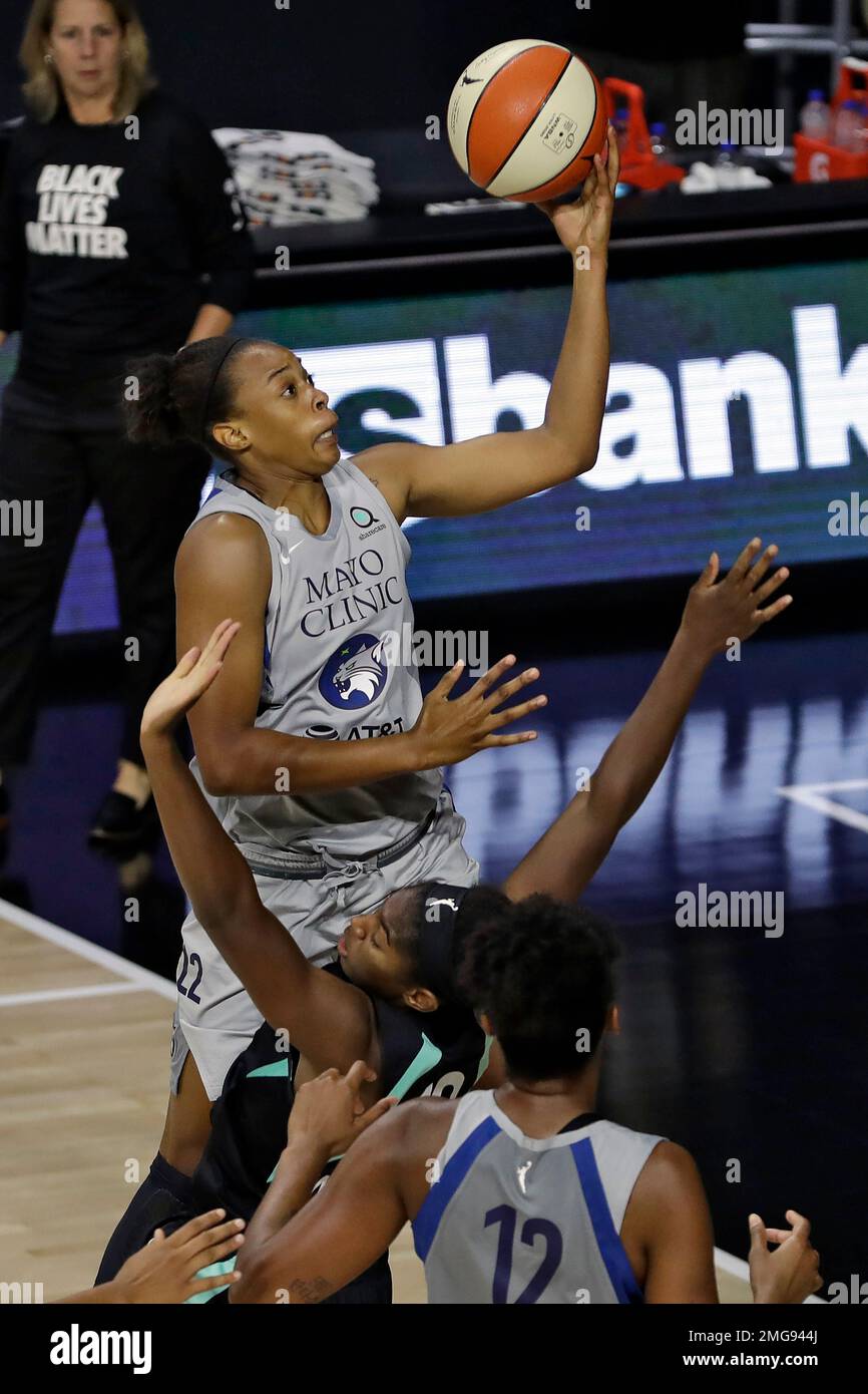 Minnesota Lynx forward Erica McCall (22) shoots over New York Liberty ...