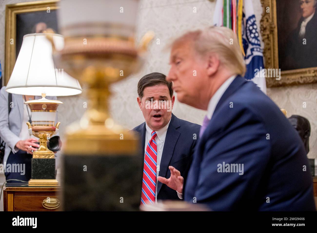 President Donald Trump meets with Arizona Gov. Doug Ducey, center, in ...