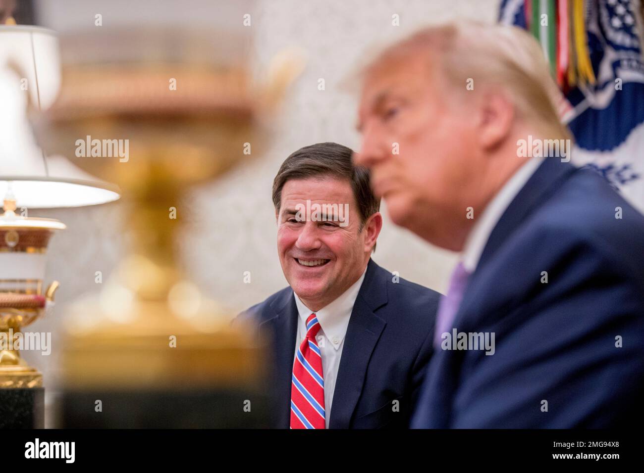 President Donald Trump meets with Arizona Gov. Doug Ducey, center, in ...