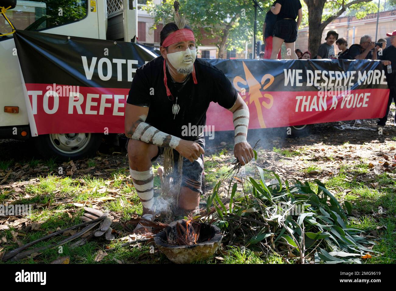 Aboriginal man Josh Sly of the Muggera Dancers prepares a fire for a ...