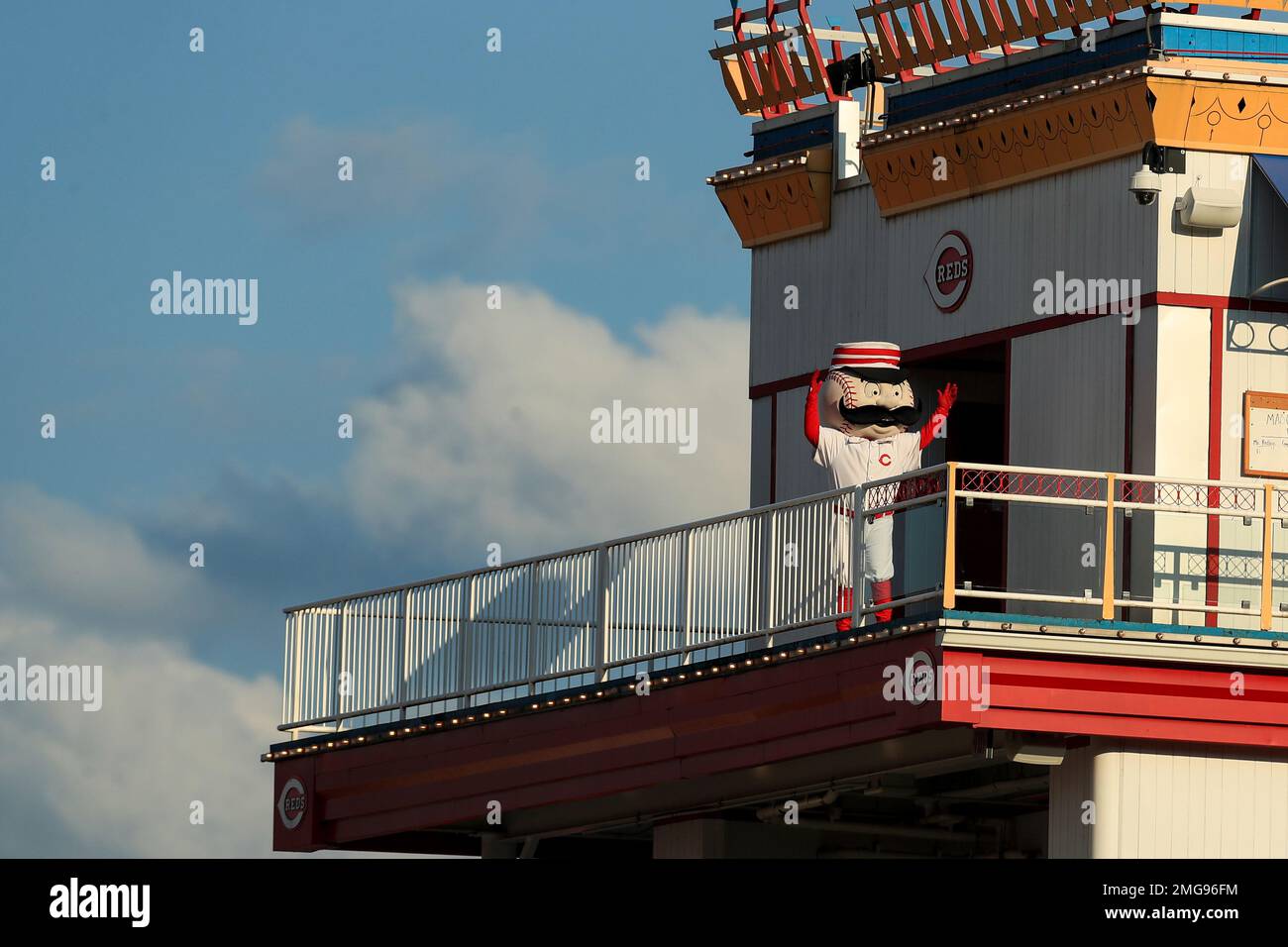 Reds' mascot Mr. Redlegs performs from the boathouse during a baseball ...