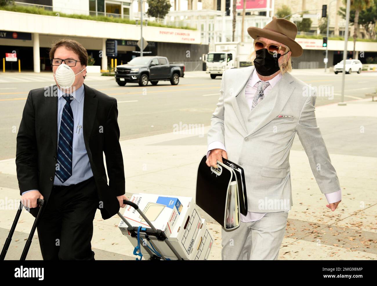 Michael Lockwood, right, arrives at the Stanley Mosk Courthouse for his ...