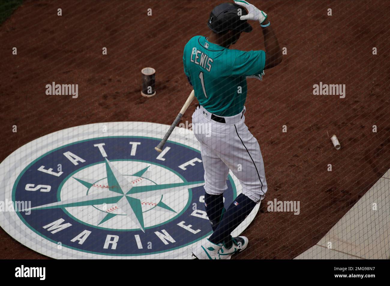 Seattle Mariners' Kyle Lewis stands near the on-deck circle during a ...