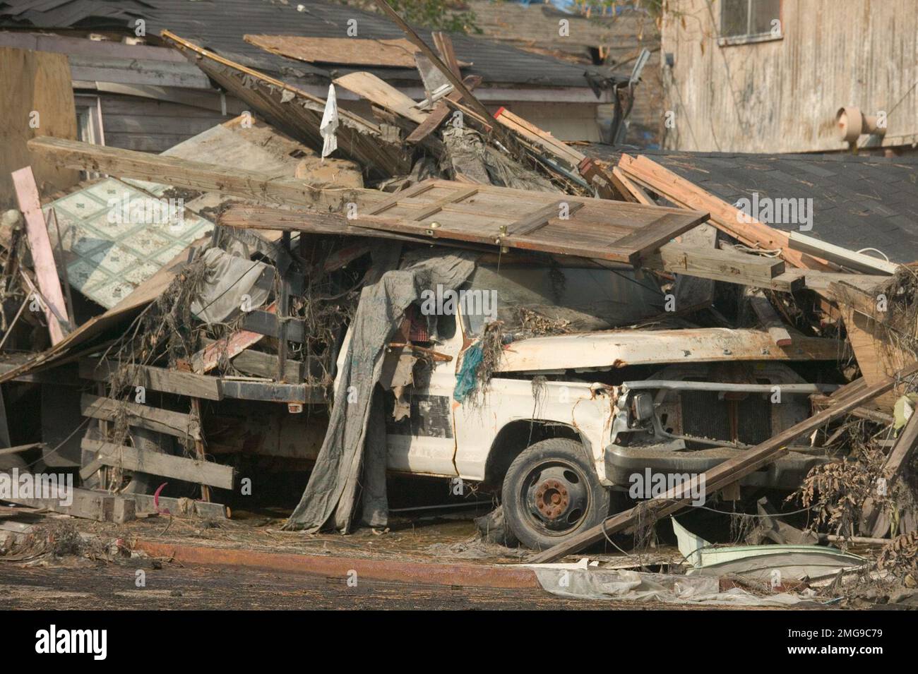 Aftermath - Parishes - 26-HK-42-2. 9th Ward Damage--pickup truck under ...