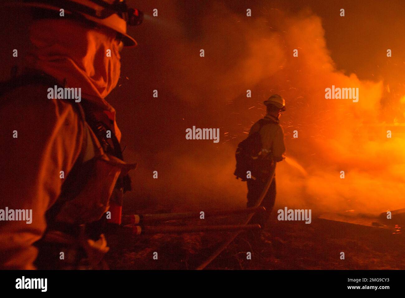 Firefighters battle the Apple Fire in Banning, Calif., Saturday, Aug. 1 ...