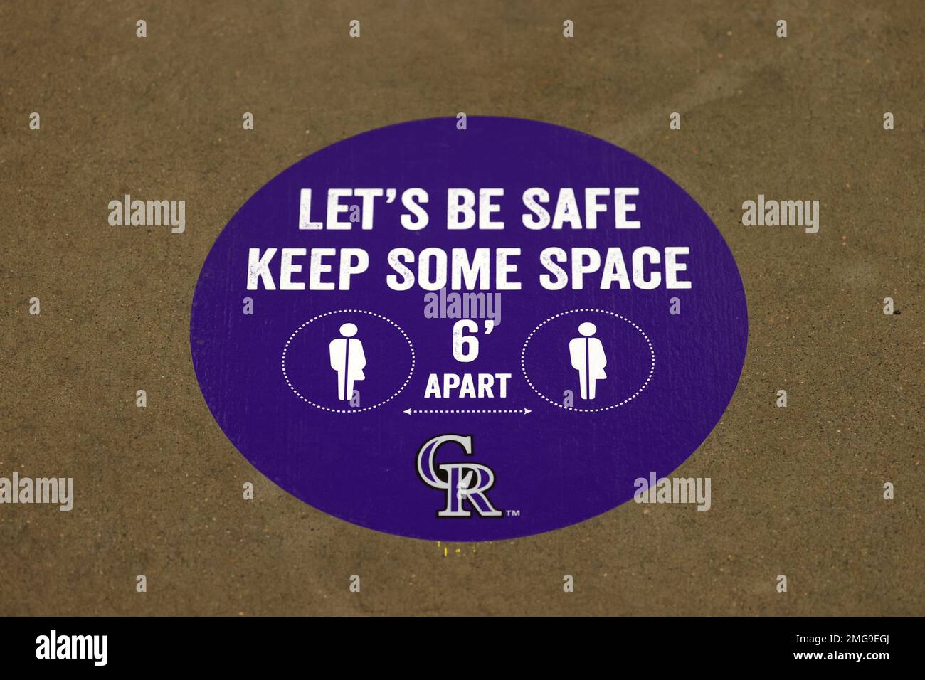 Signs encouraging social distancing line the main concourse of an empty ...