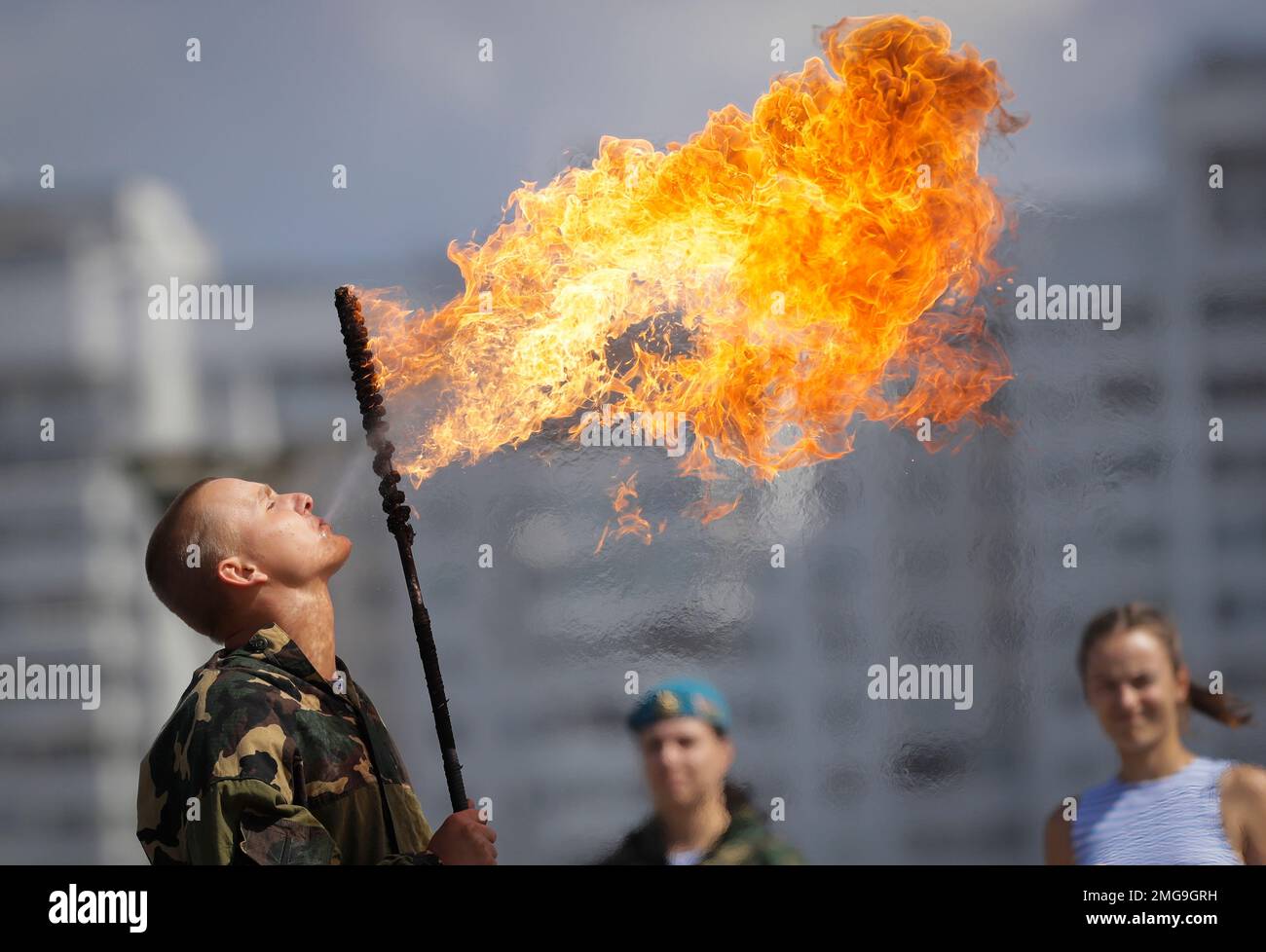Belarusian paratroopers perform during a military show marking the 90th ...