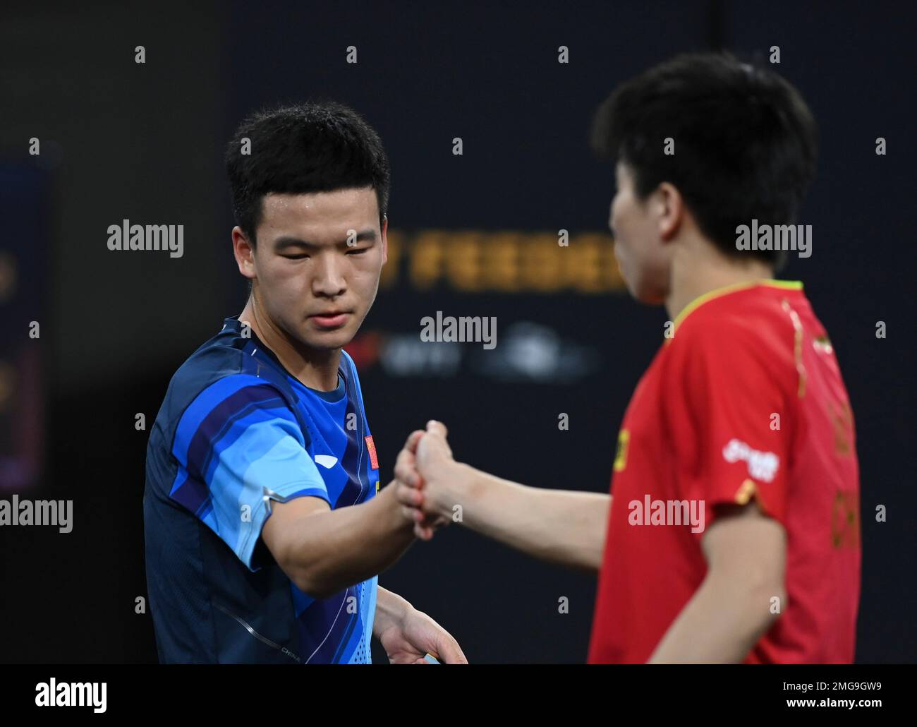 Doha, Qatar. 25th Jan, 2023. Xiang Peng (L) of China greets his ...