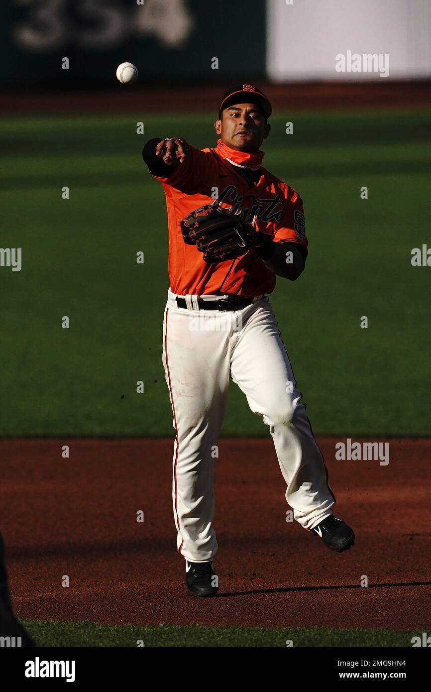 San Francisco Giants' Donovan Solano throws out Texas Rangers' Todd ...