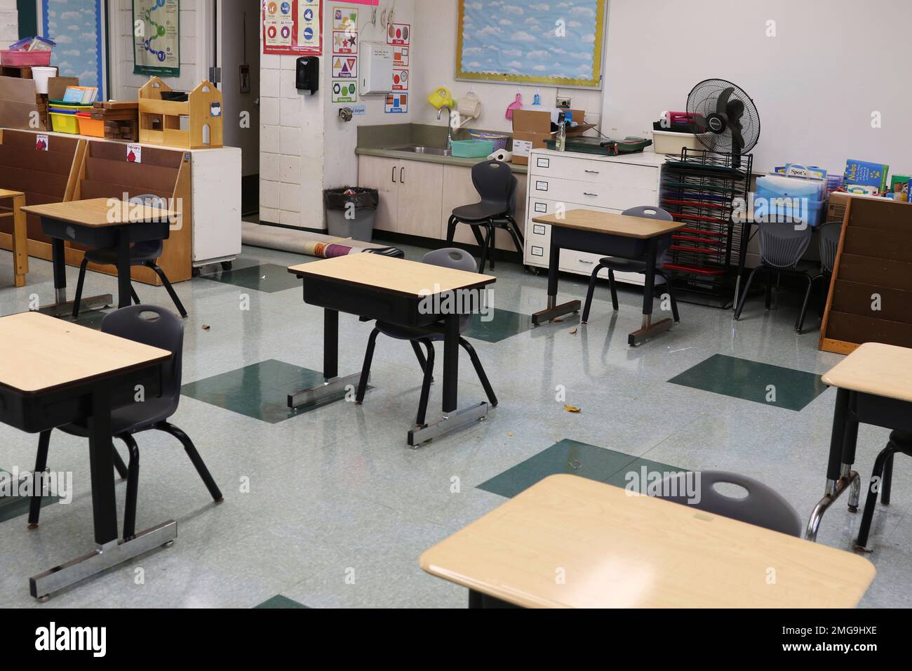 Desks are spaced out in a classroom at Aikahi Elementary School in ...