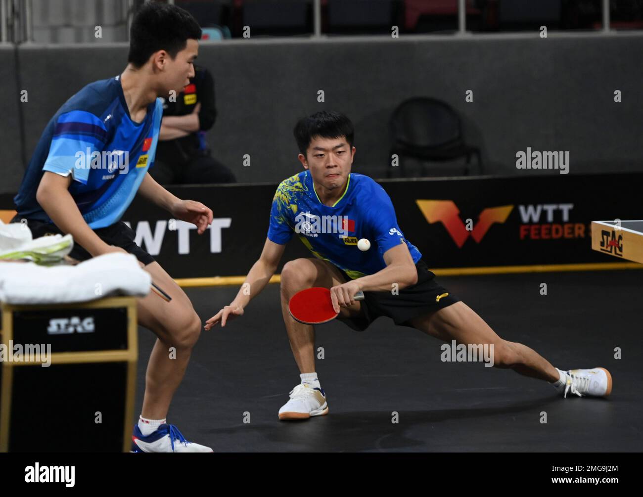 Doha, Qatar. 25th Jan, 2023. Yuan Licen (R)/Xiang Peng of China compete ...