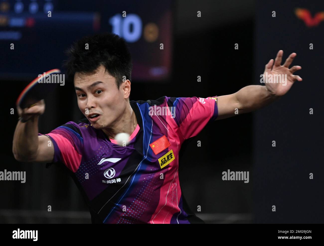Doha, Qatar. 25th Jan, 2023. Zhou Qihao of China hits a return during ...