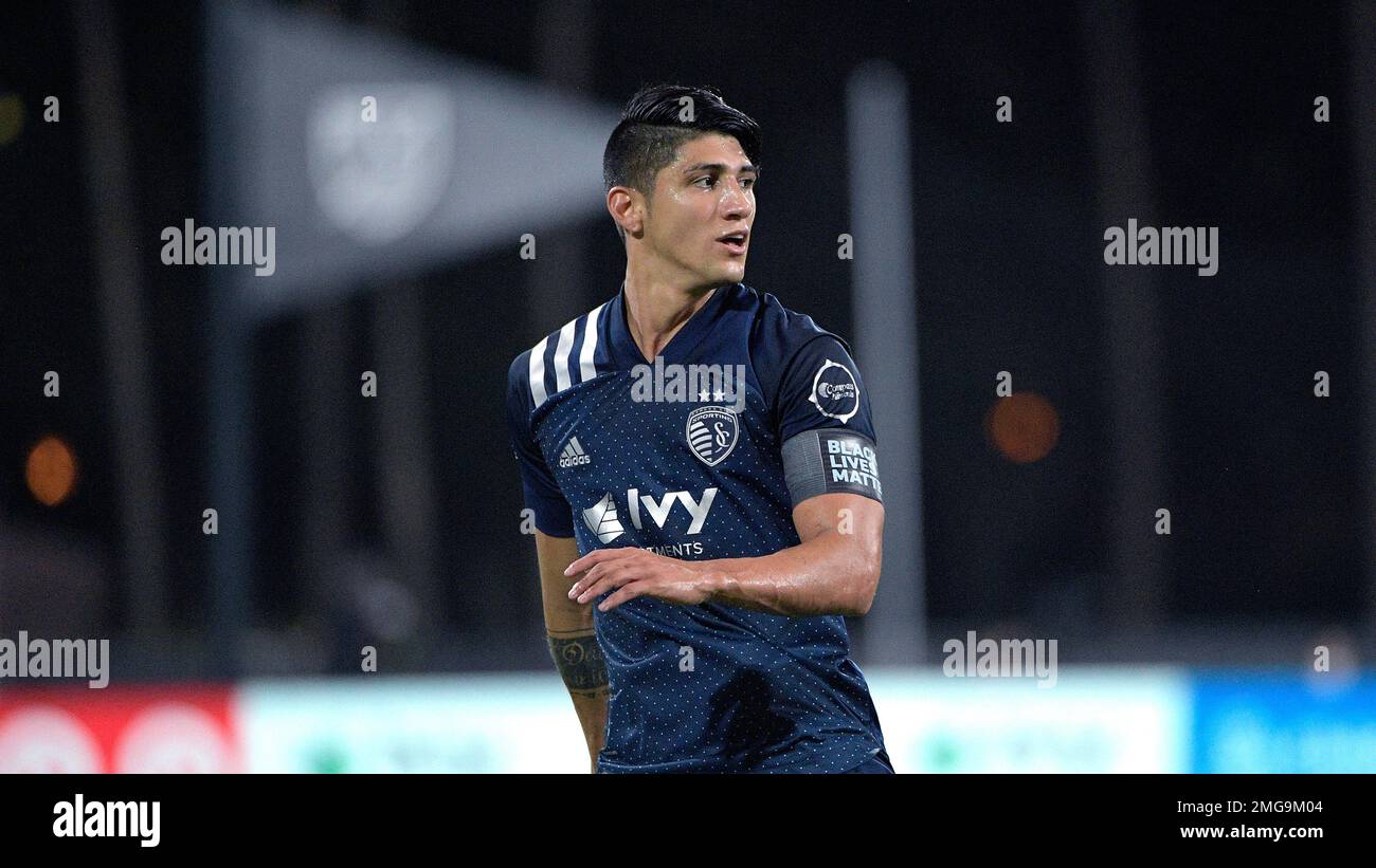 Sporting Kansas City forward Alan Pulido (9) follows a play during the ...