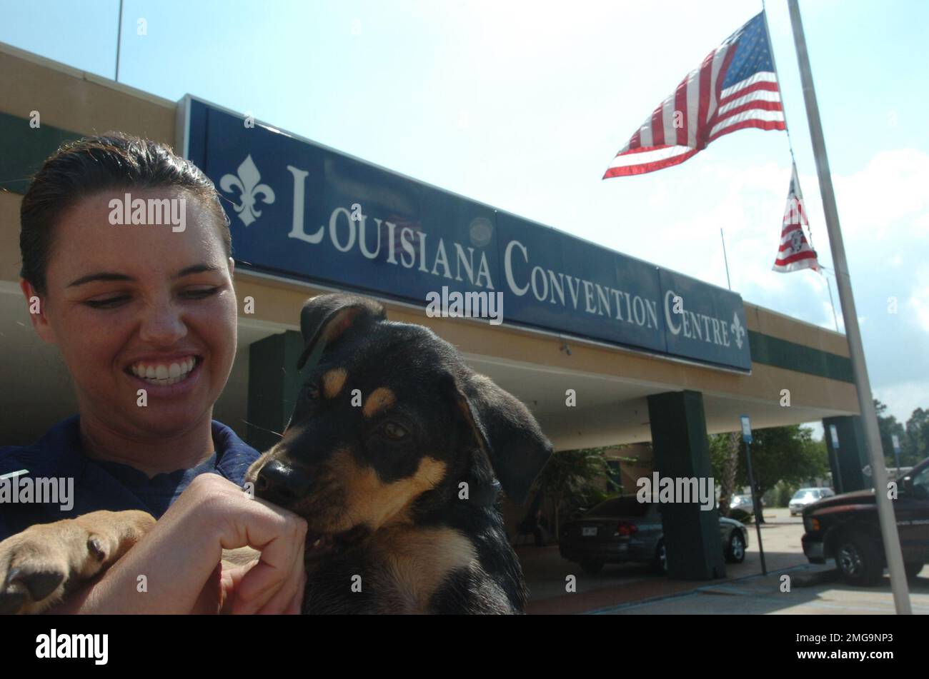 Animals - 26-HK-58-19. Coast Guard woman with dog outside LA Convention ...