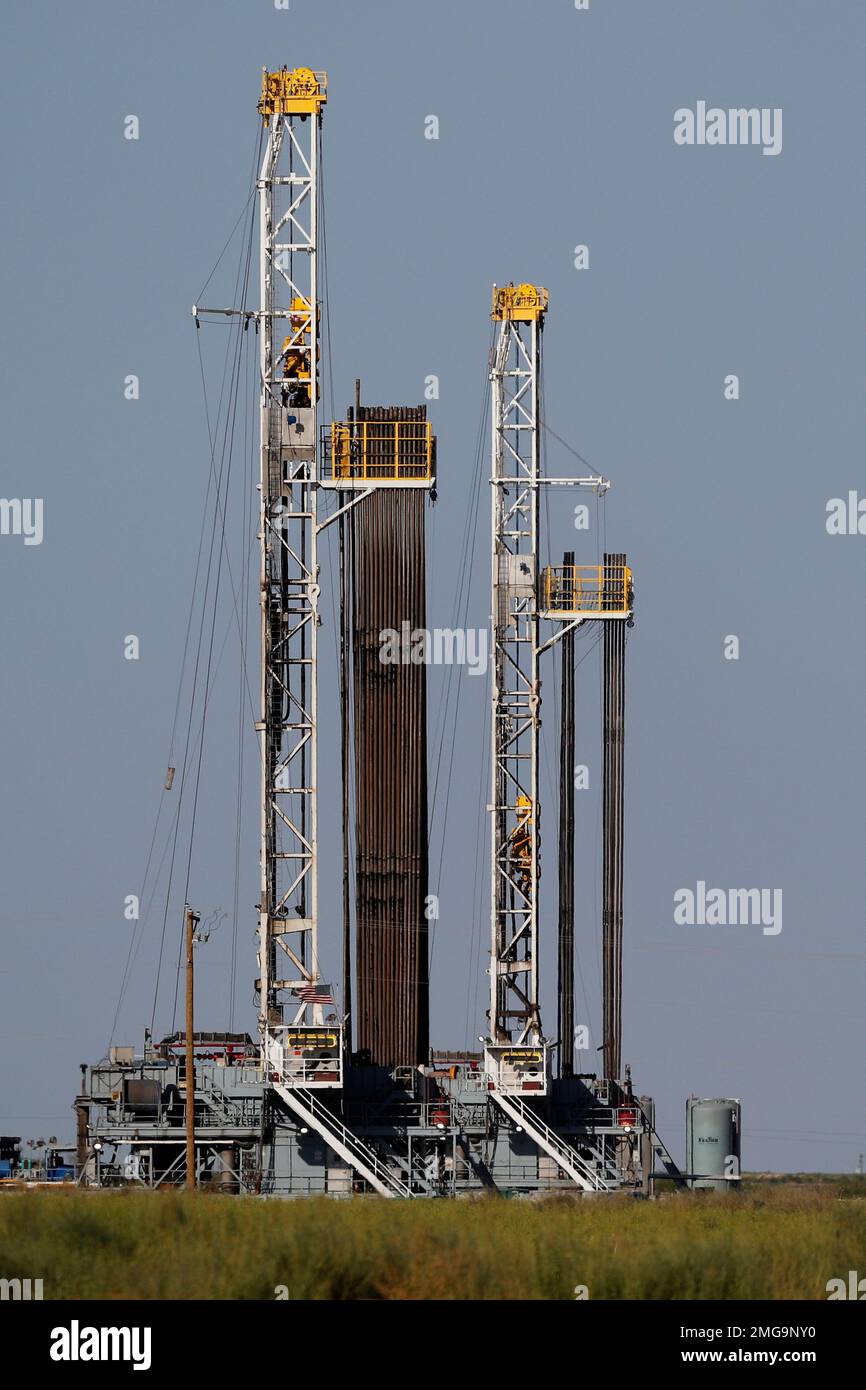 Oil rigs are shown in a rural area, Wednesday, July 29, 2020, in ...
