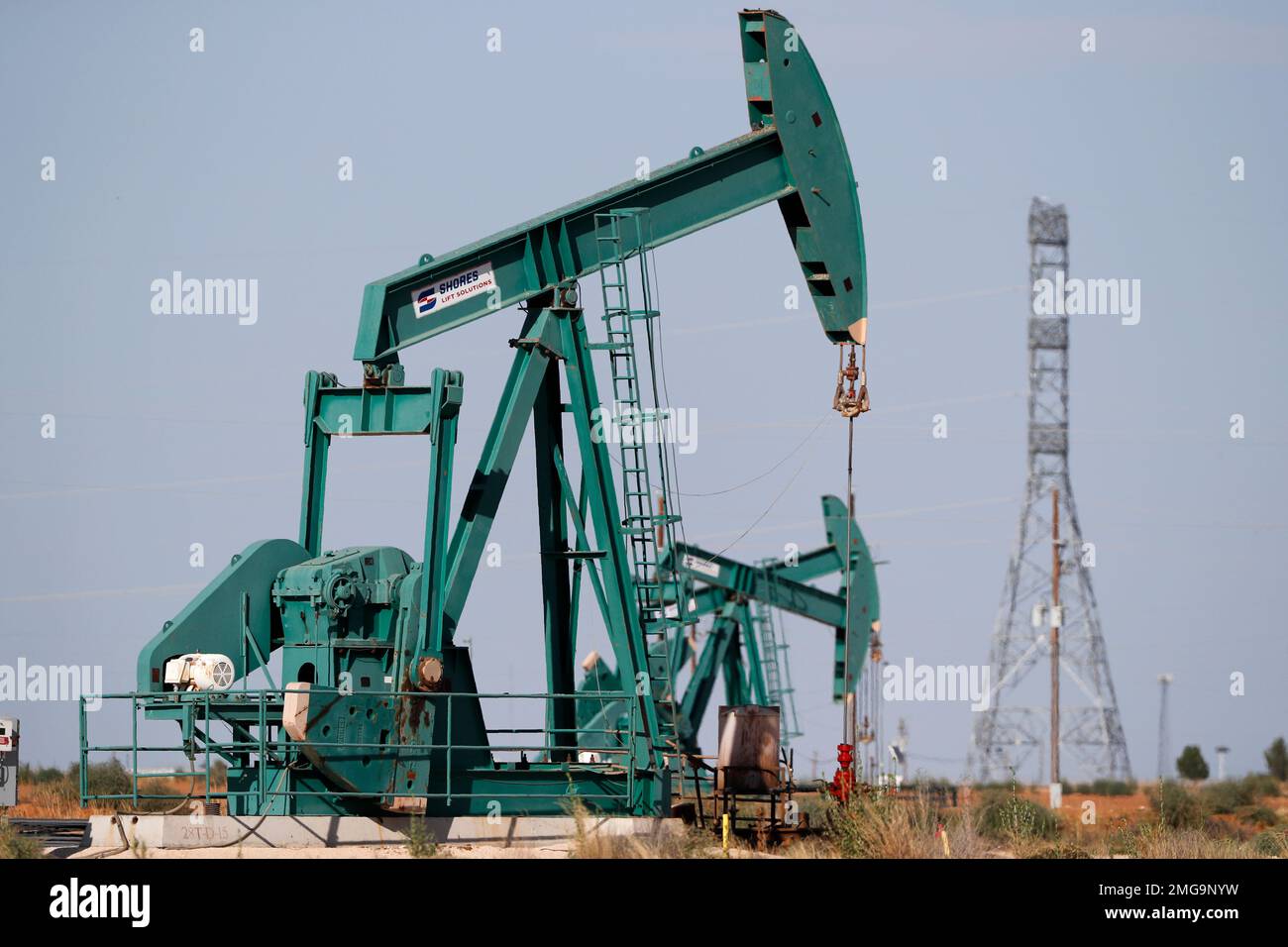 Pump jacks are shown in an oil field, Wednesday, July 29, 2020, in ...