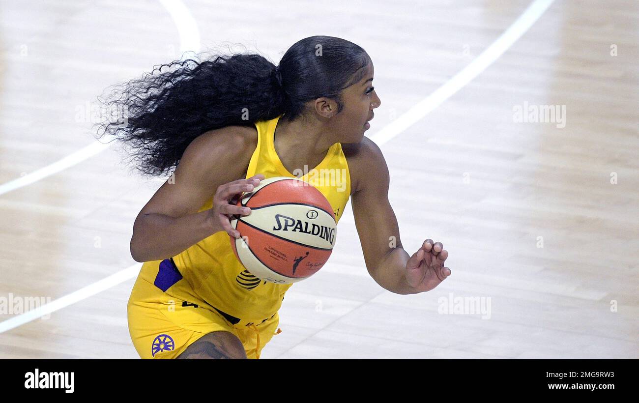 Los Angeles Sparks guard Te'a Cooper (4) brings a ball up the court ...