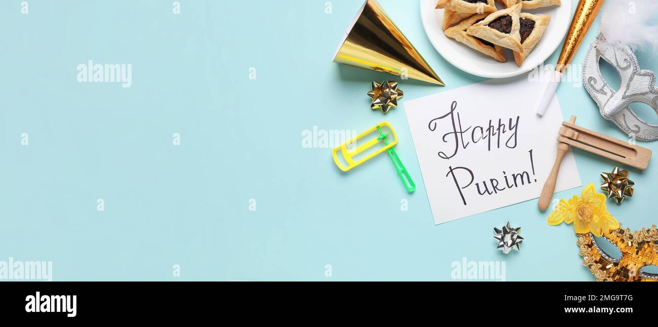 Greeting card and symbols of Purim on light blue background with space ...