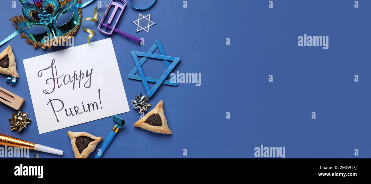 Greeting card and symbols of Purim on blue background with space for ...