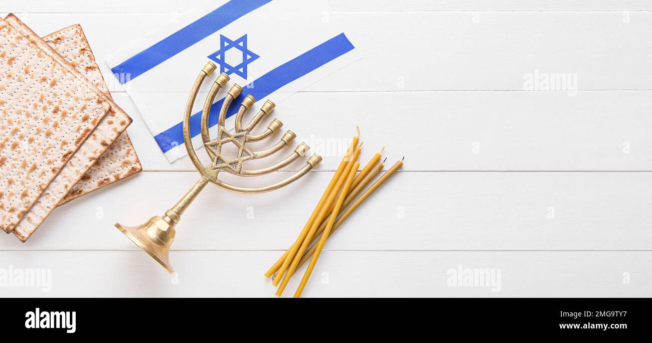 Symbols of Judaism with flag of Israel on white wooden background with ...
