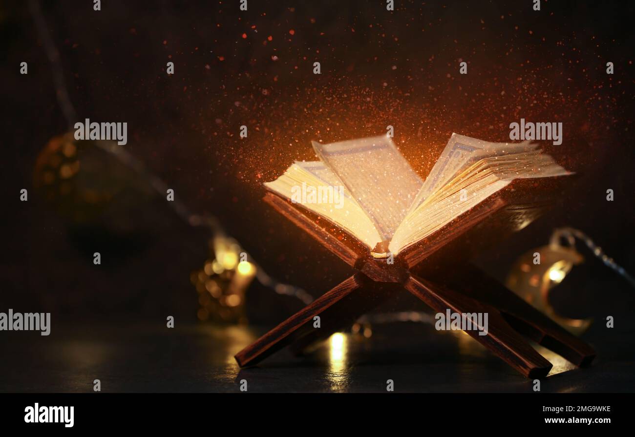 Rehal with Quran book on dark background Stock Photo - Alamy