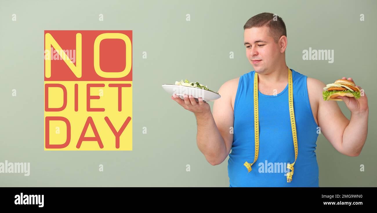Overweight man with measuring tape, salad and burger on grey background ...