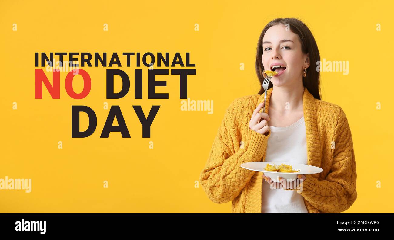 Beautiful young woman eating tasty ravioli on yellow background ...