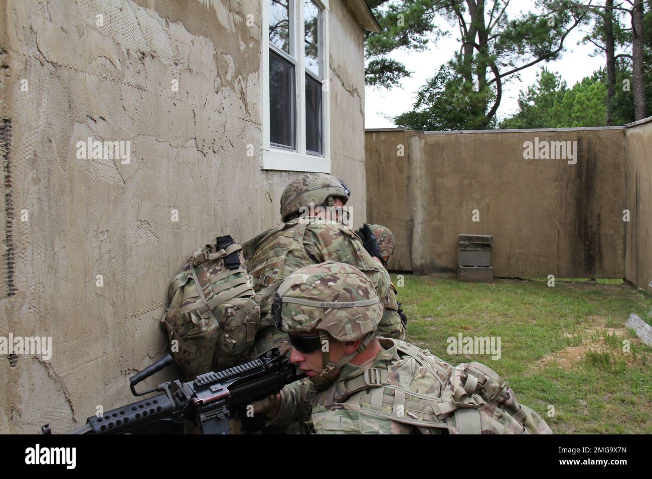 SPC Patrick Chayeb and SPC Matthew Ruiz move past a window at the ...