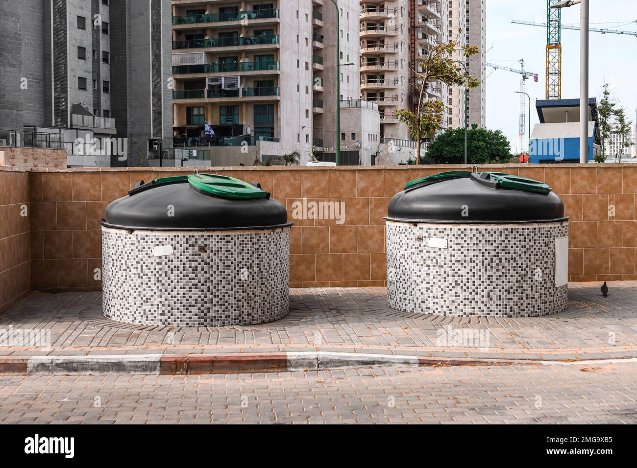 Modern garbage containers on city street Stock Photo - Alamy