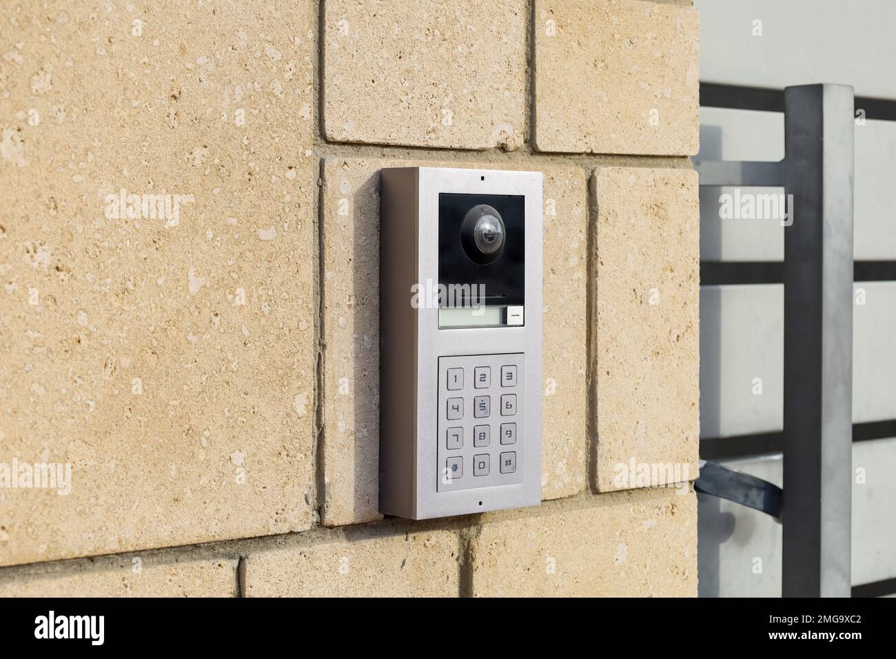 Modern intercom on brick wall Stock Photo - Alamy