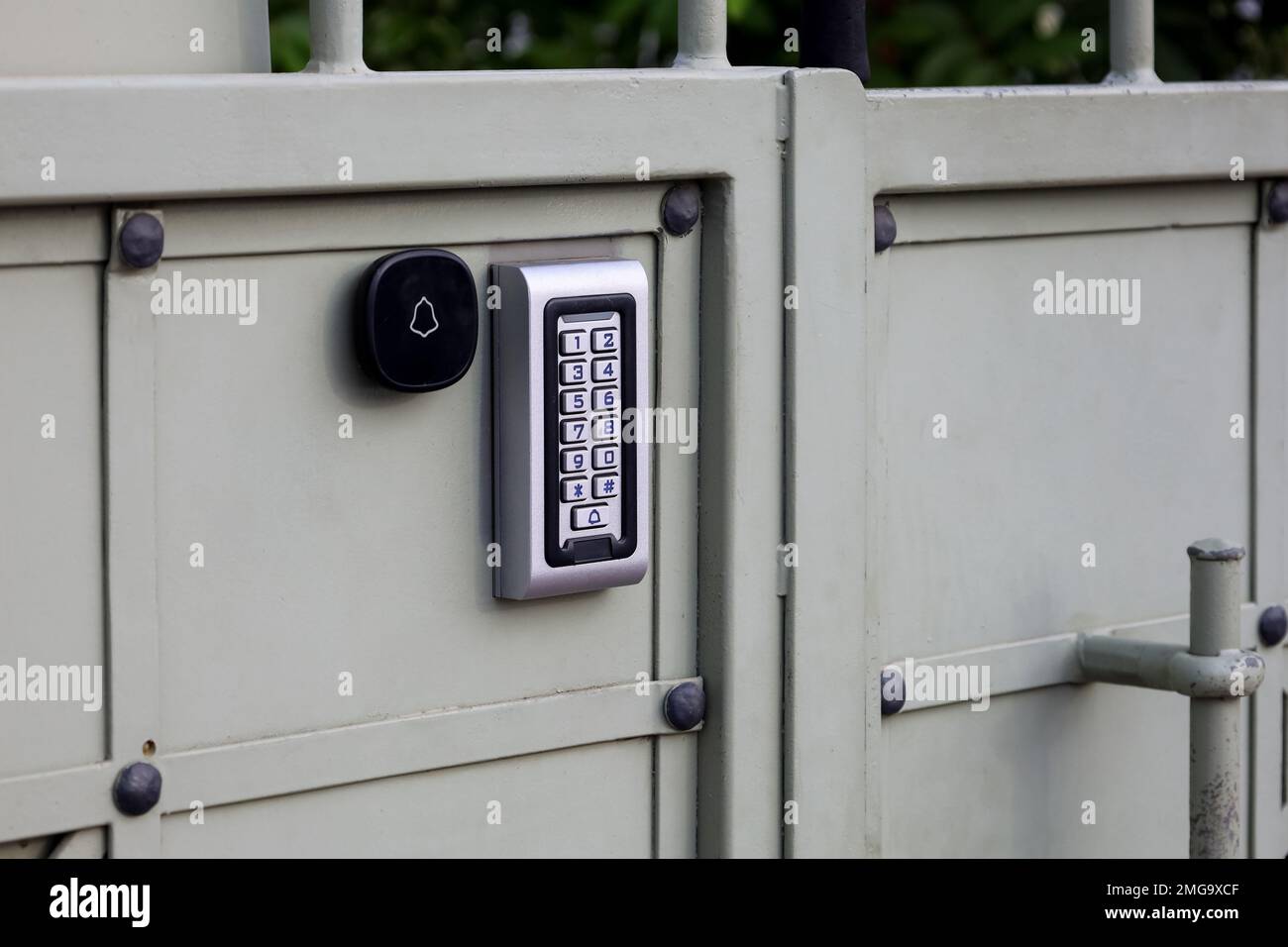 Modern intercom on metal fence Stock Photo - Alamy