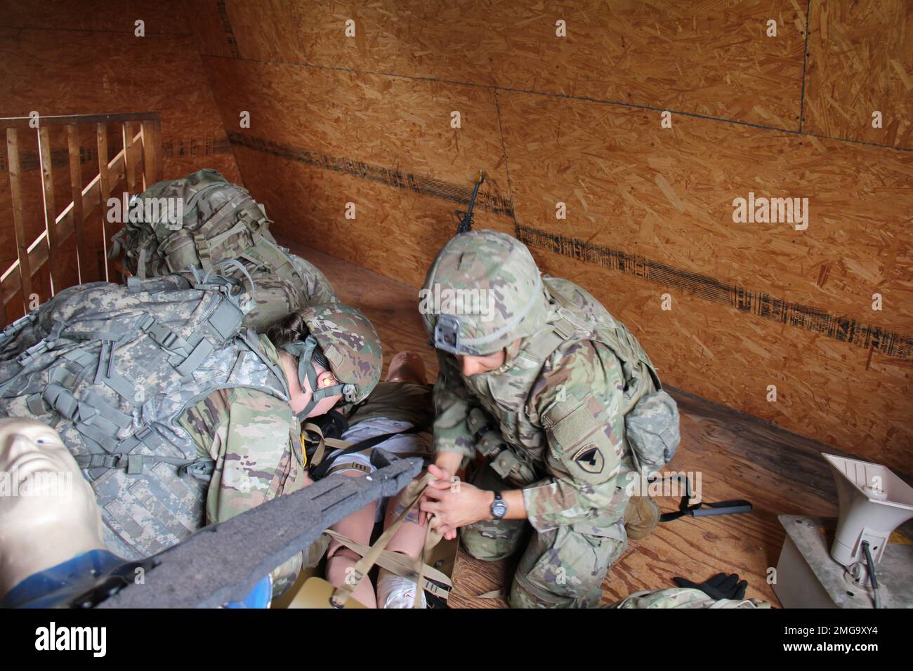 SPC Alyssa Reyes and SPC Matthew Ruiz practice rescuing an injured ...