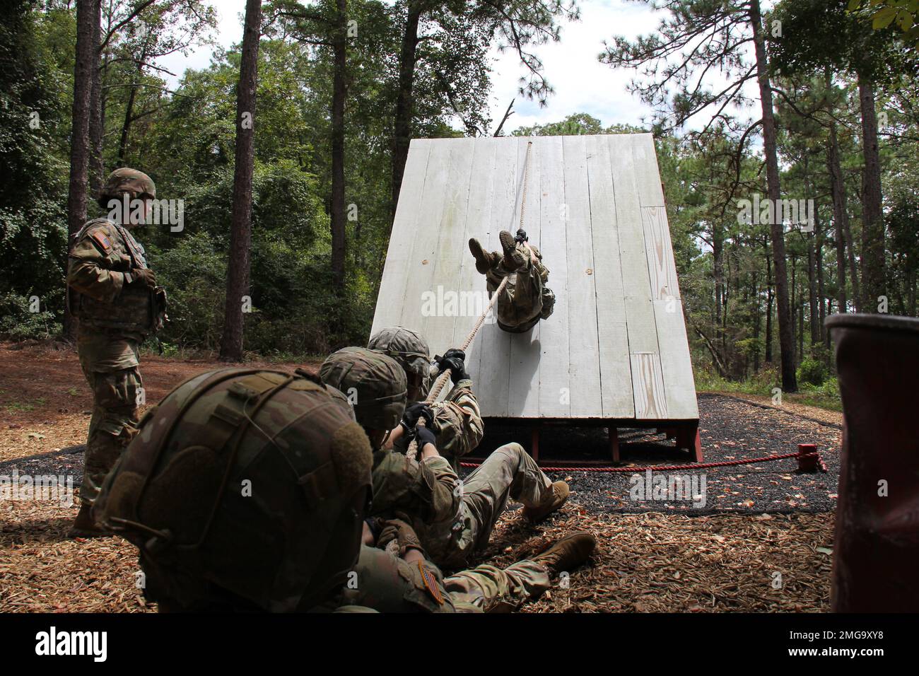 The AMC Best Squad navigates an obstacle at the leadership reaction ...