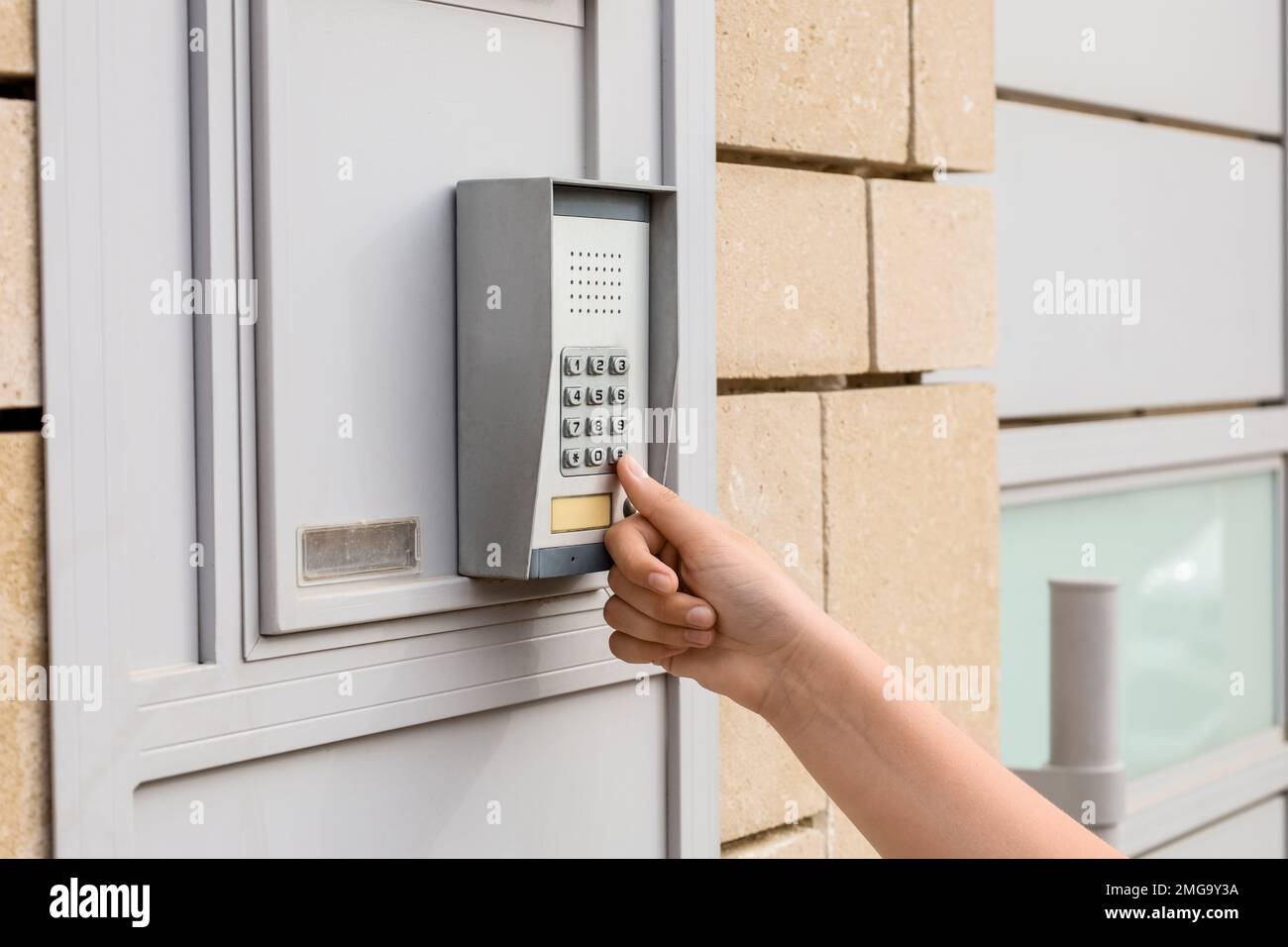 Child using intercom outdoors, closeup Stock Photo - Alamy
