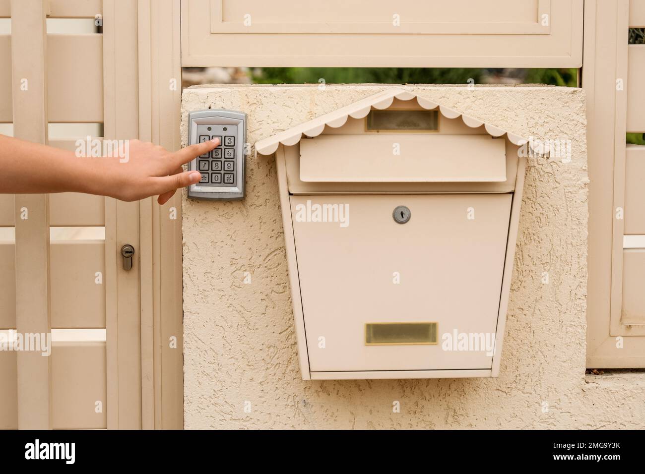 Child using intercom on fence outdoors, closeup Stock Photo - Alamy