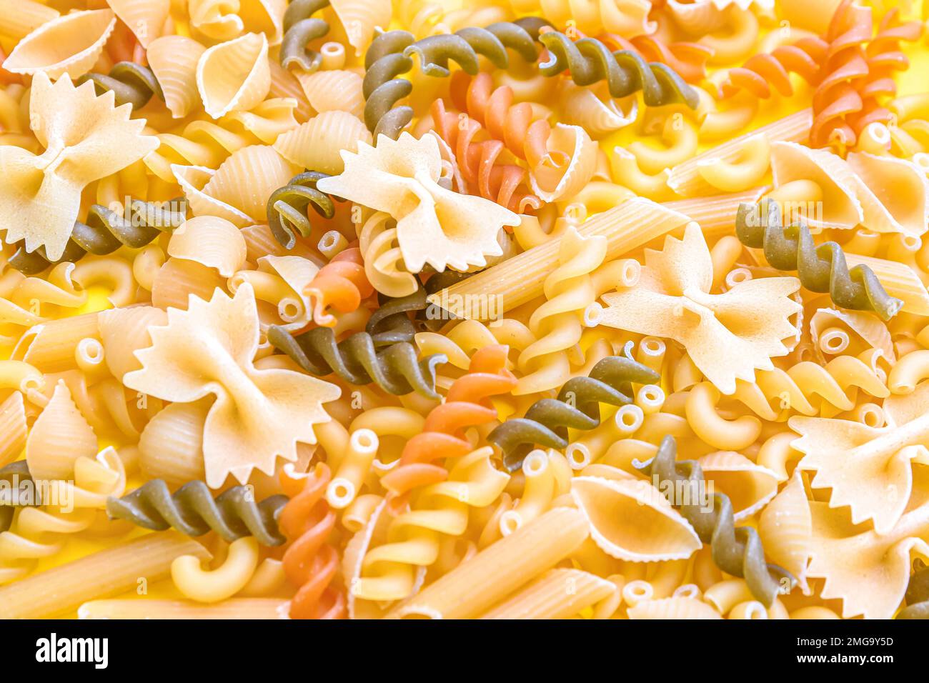 Different types of raw pasta as background, closeup Stock Photo - Alamy